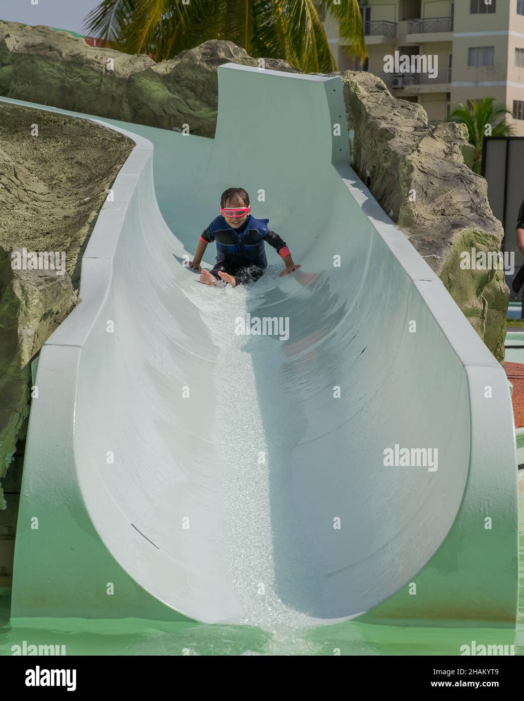 Boy sliding on water slide hi-res stock photography and images - Alamy