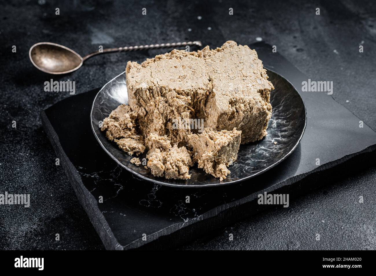 Homemade sunflower halva with honey. Black background. Top view Stock Photo - Alamy