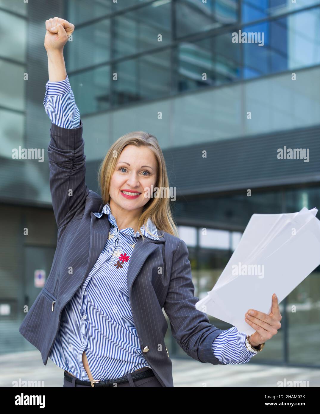 Professional woman in jacket working with documents Stock Photo - Alamy