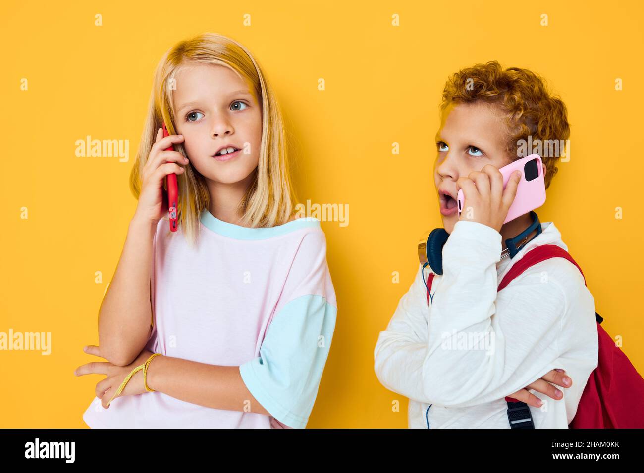 cute kids looking at the phone entertainment communication yellow ...