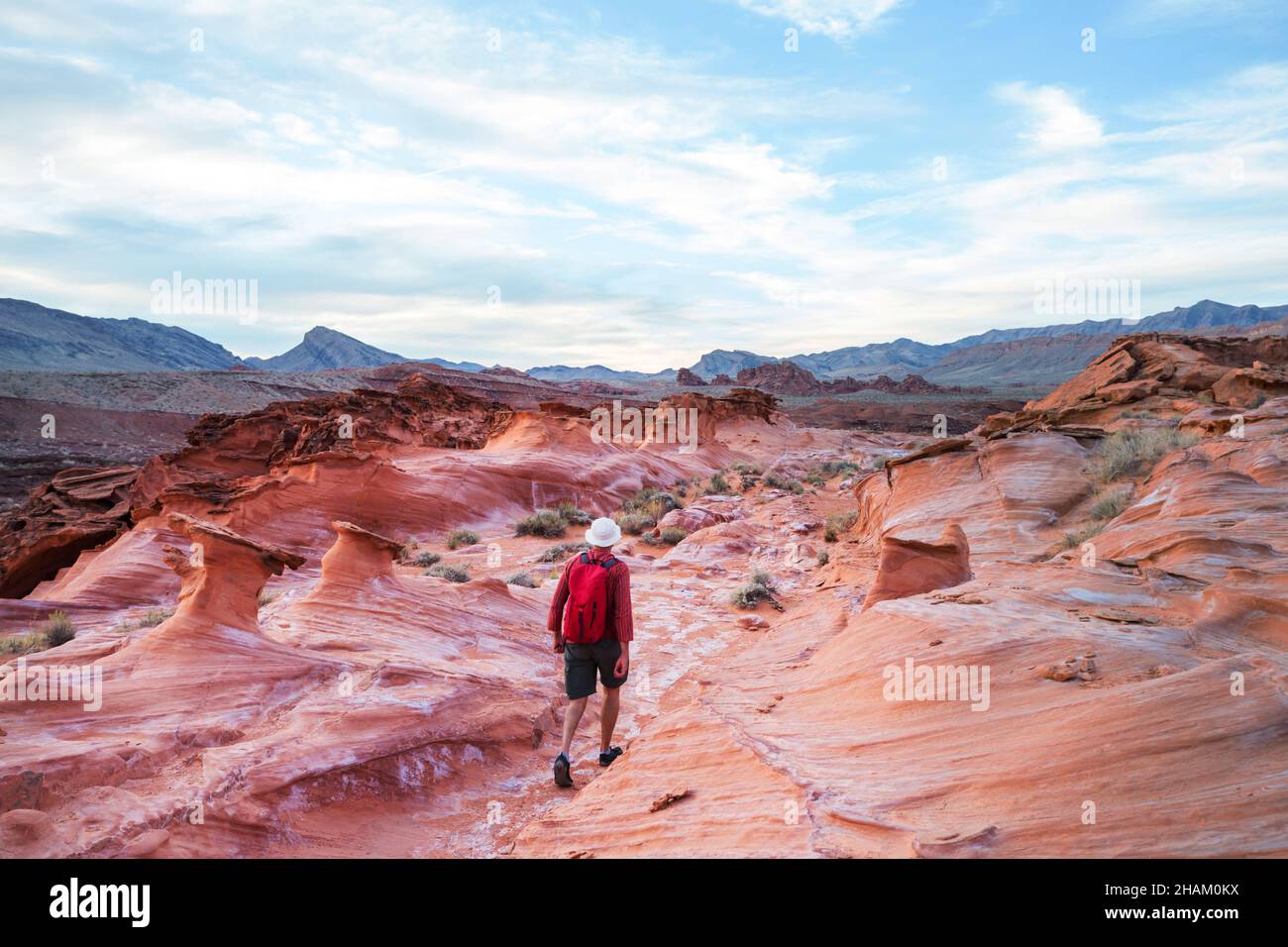 Hiker inside a stone arch in the Nevada desert near Las Vegas, Nevada ...