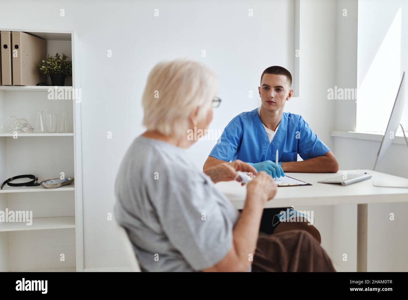 the patient is examined by a doctor diagnostics Stock Photo - Alamy