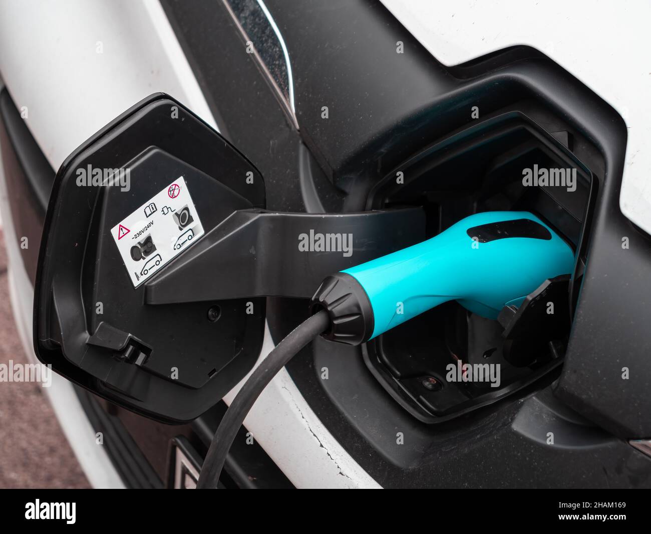 Closeup of an electric car charging its battery Stock Photo - Alamy