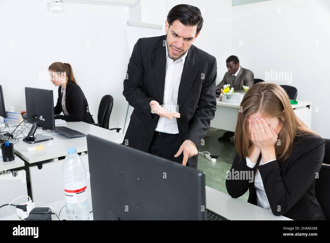 Outraged businessman expressing dissatisfaction with girl Stock Photo ...