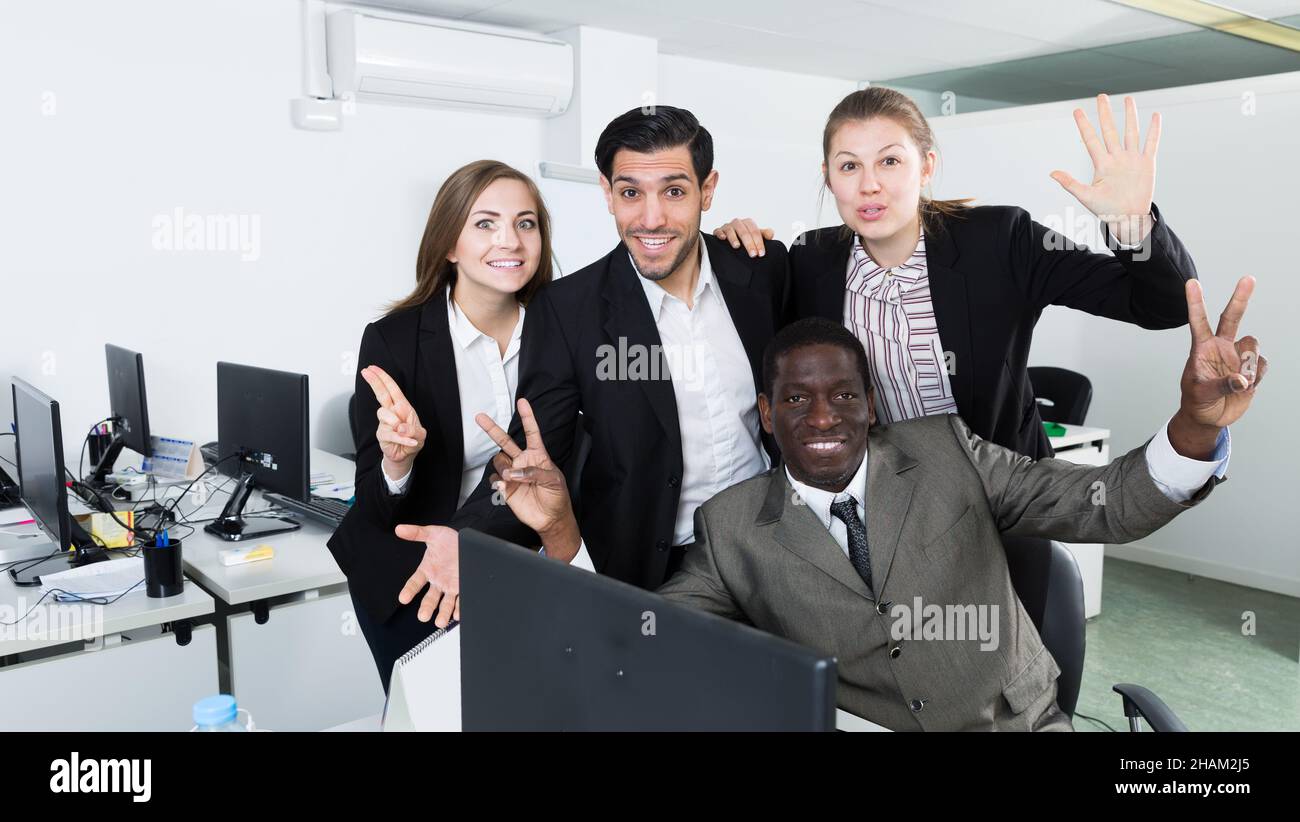 friendly team of colleagues in the office Stock Photo - Alamy