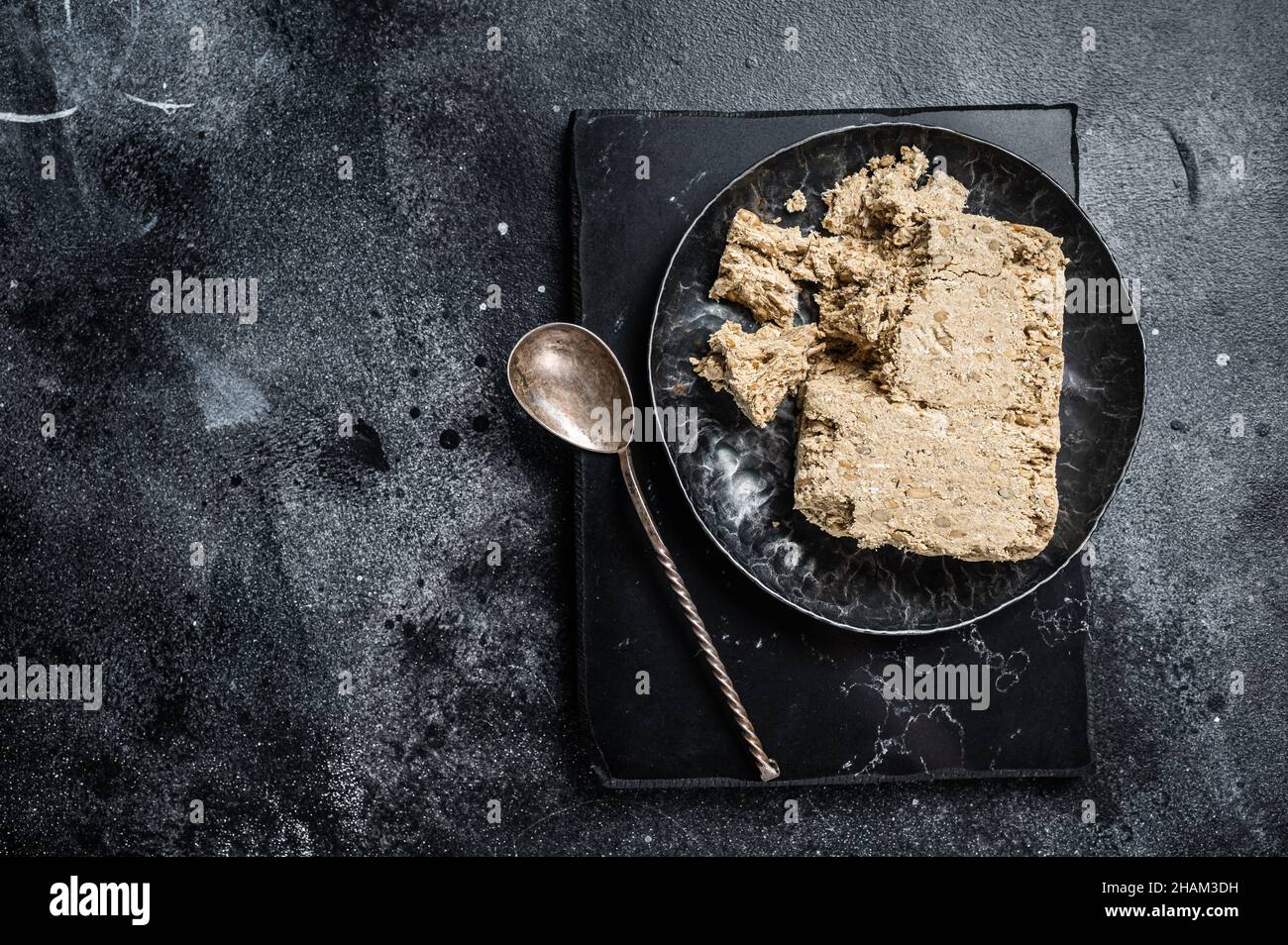 Homemade sunflower halva with honey. Black background. Top view. Copy space Stock Photo - Alamy