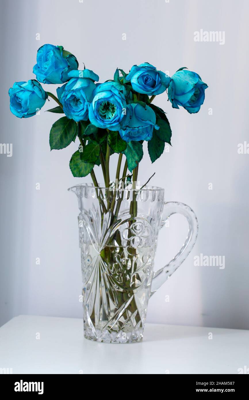 Small bouquet of blue rose Stock Photo - Alamy