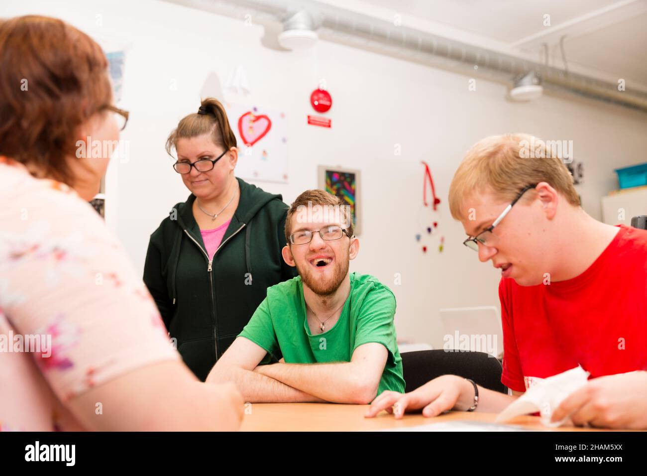 Disabled people laughing and talking Stock Photo - Alamy