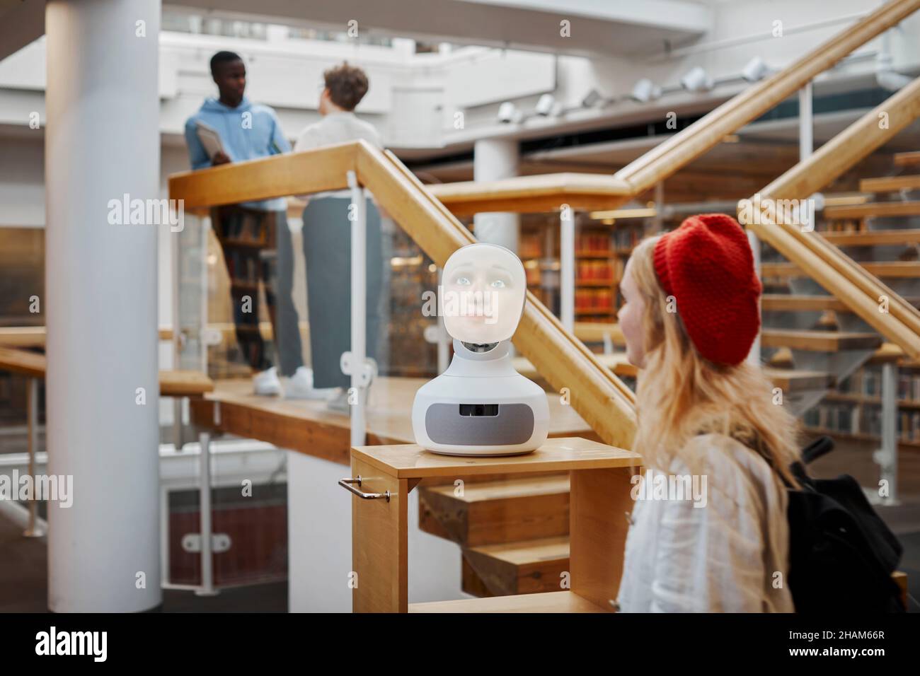 Student using voice assistant in library Stock Photo - Alamy