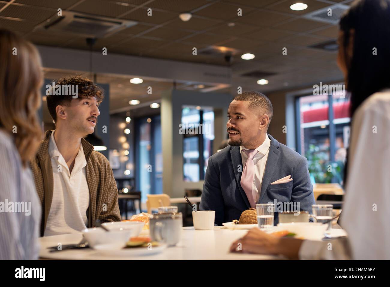 Women talking during meal hi-res stock photography and images - Alamy