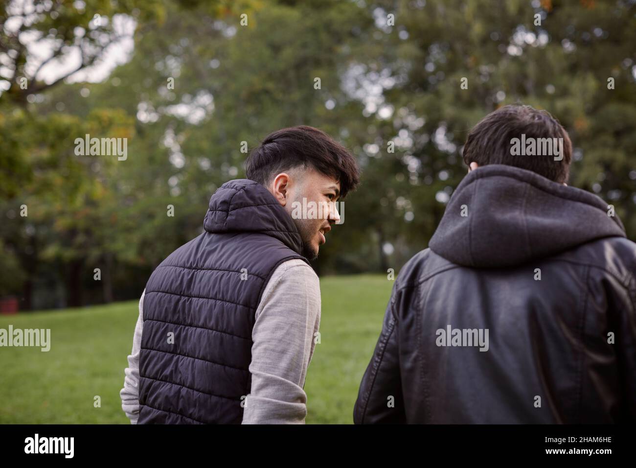 Friends walking together through park hi-res stock photography and ...
