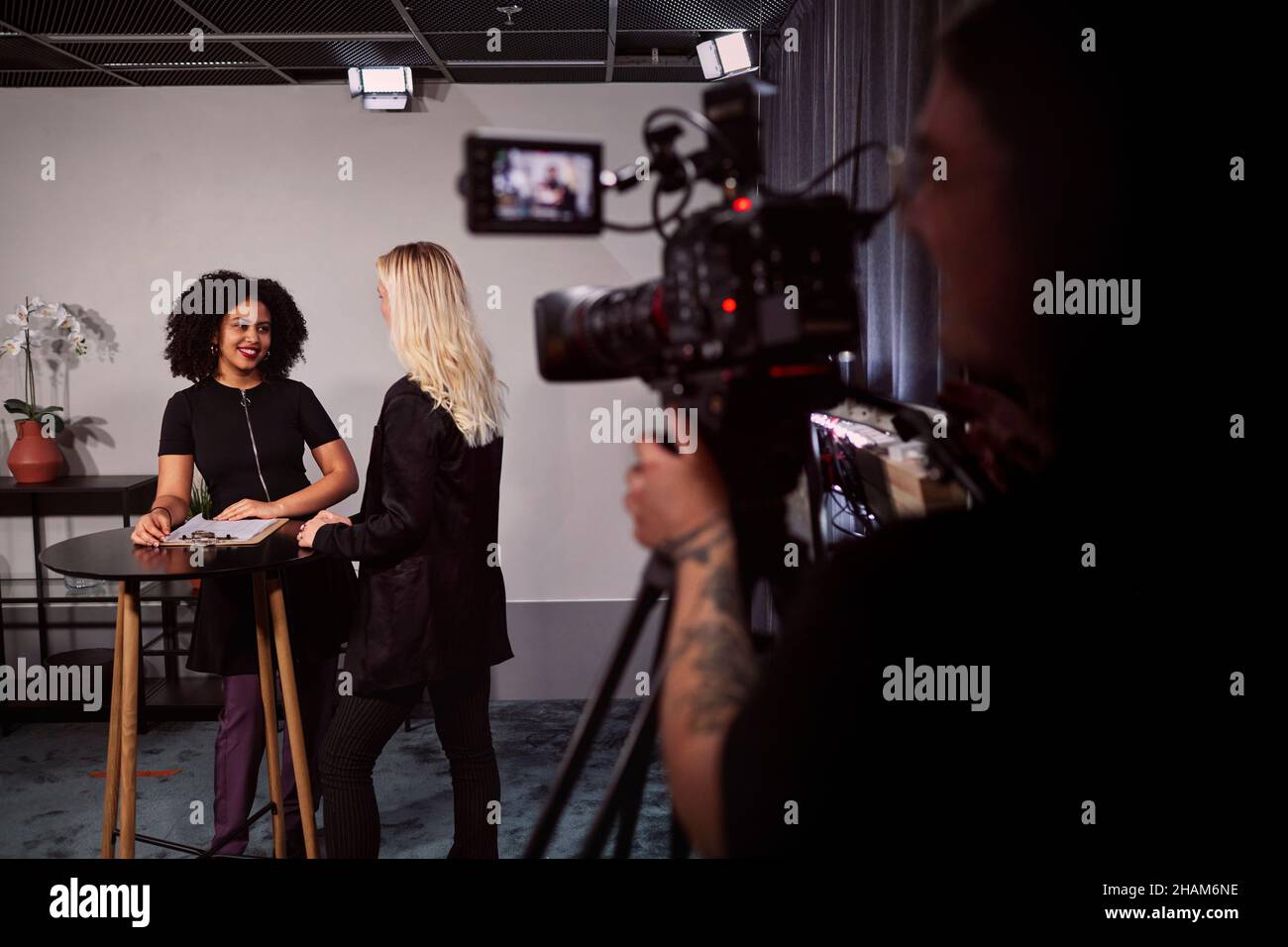 Female news anchors reporting news in studio Stock Photo - Alamy