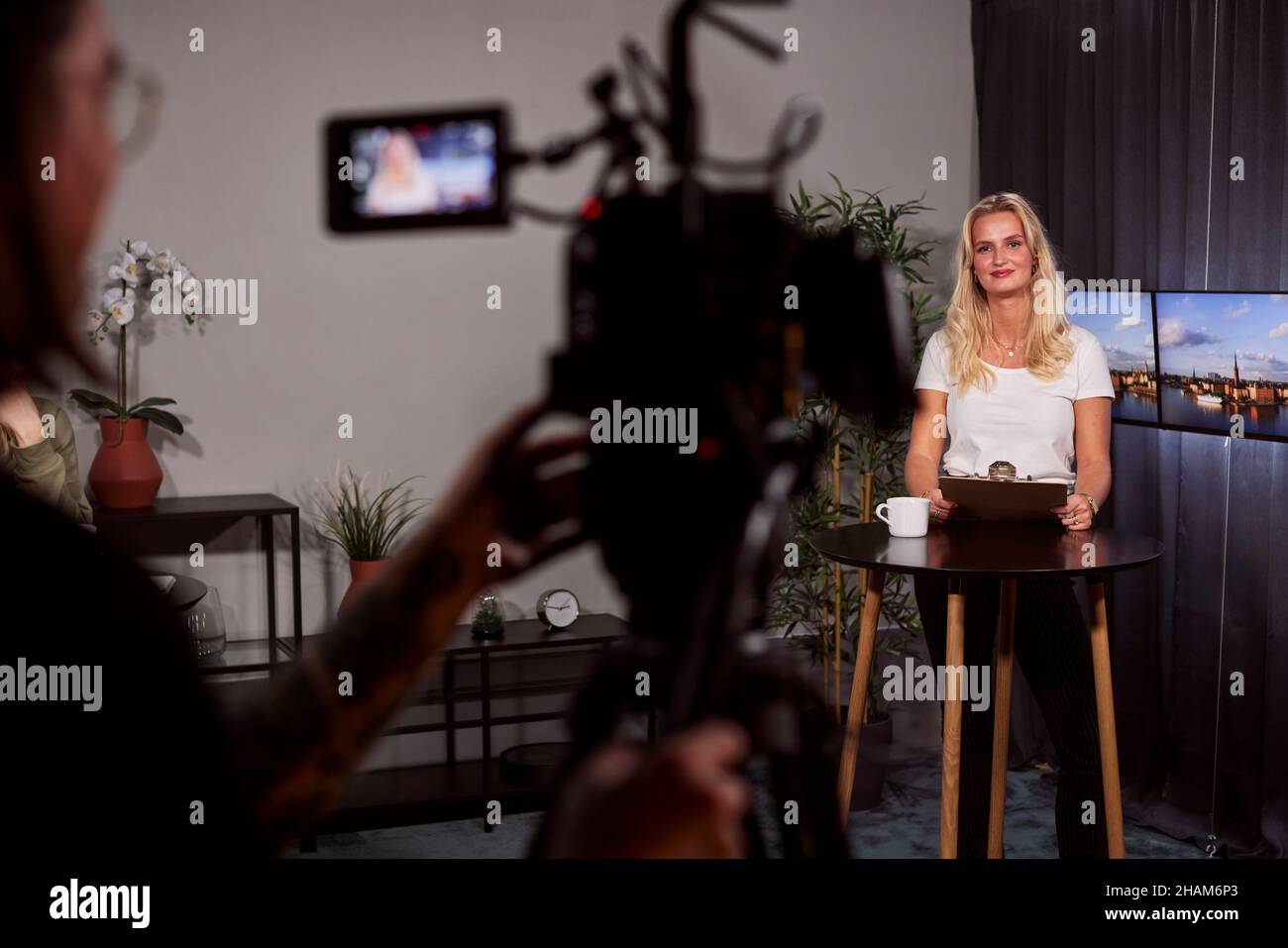 Young female news anchor in studio Stock Photo - Alamy