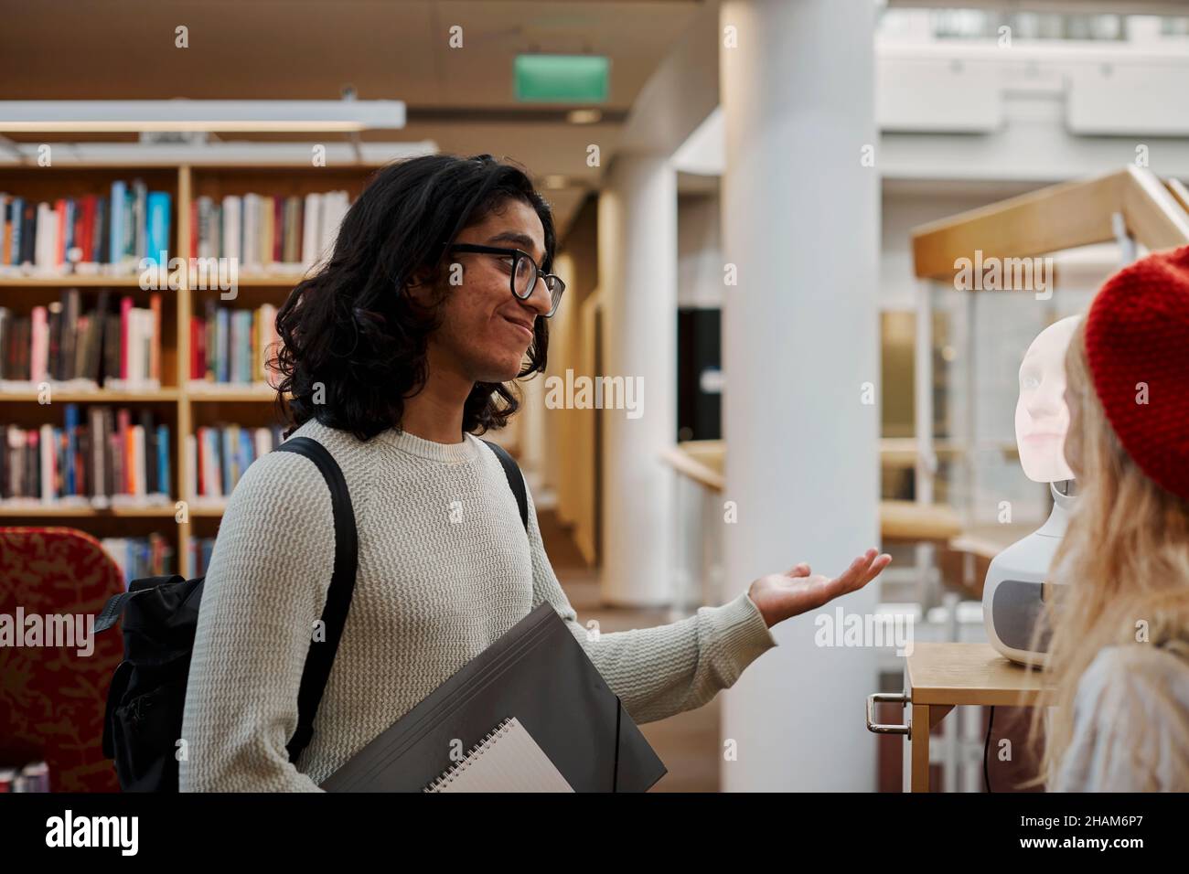 Students using voice assistant in library Stock Photo - Alamy