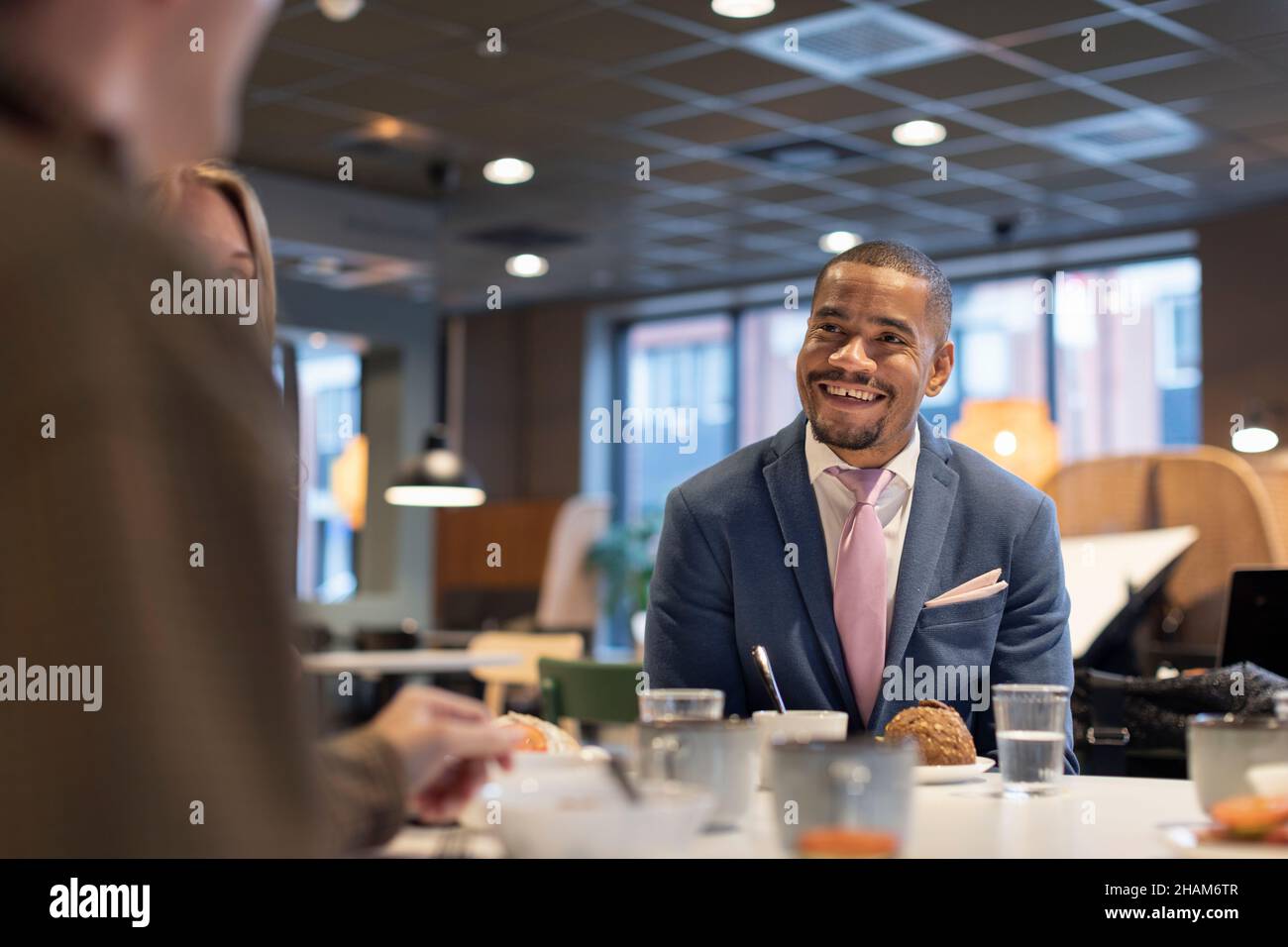 Smiling man in cafe Stock Photo - Alamy