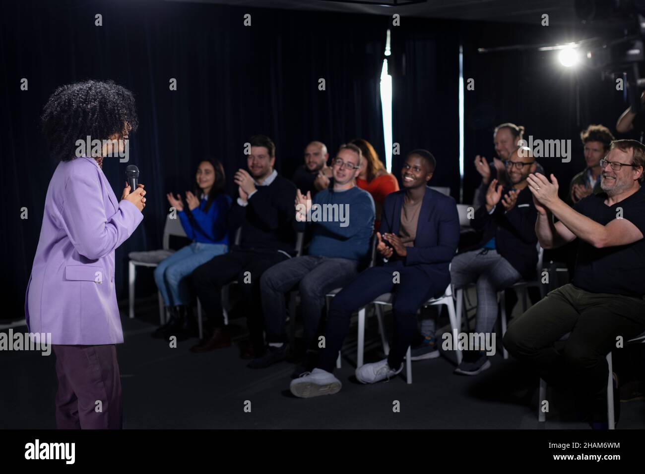 Audience applauding TV show host Stock Photo - Alamy