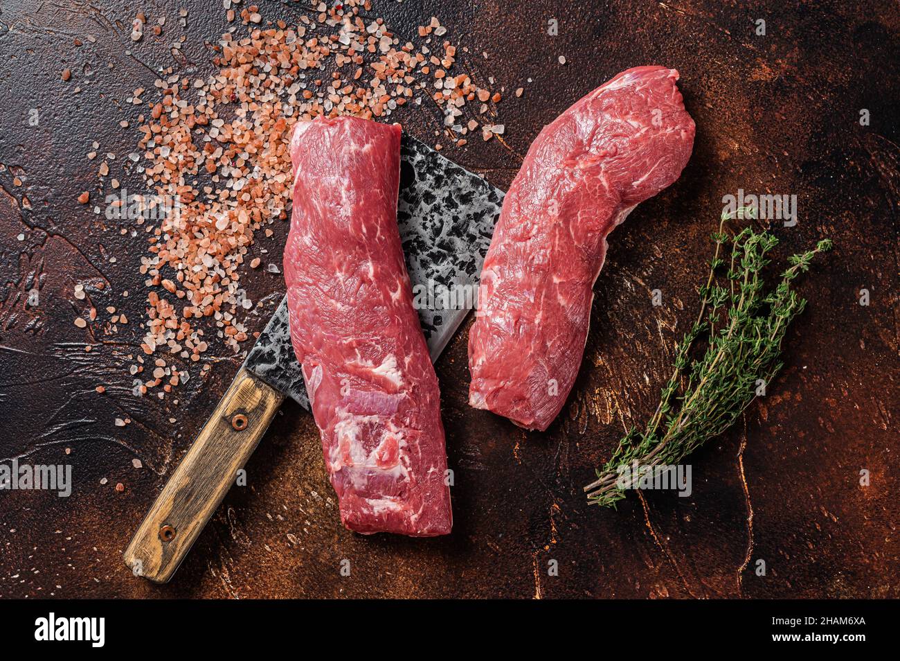 Uncooked lamb loin fillet, Mutton raw meat on butcher cleaver. Dark ...