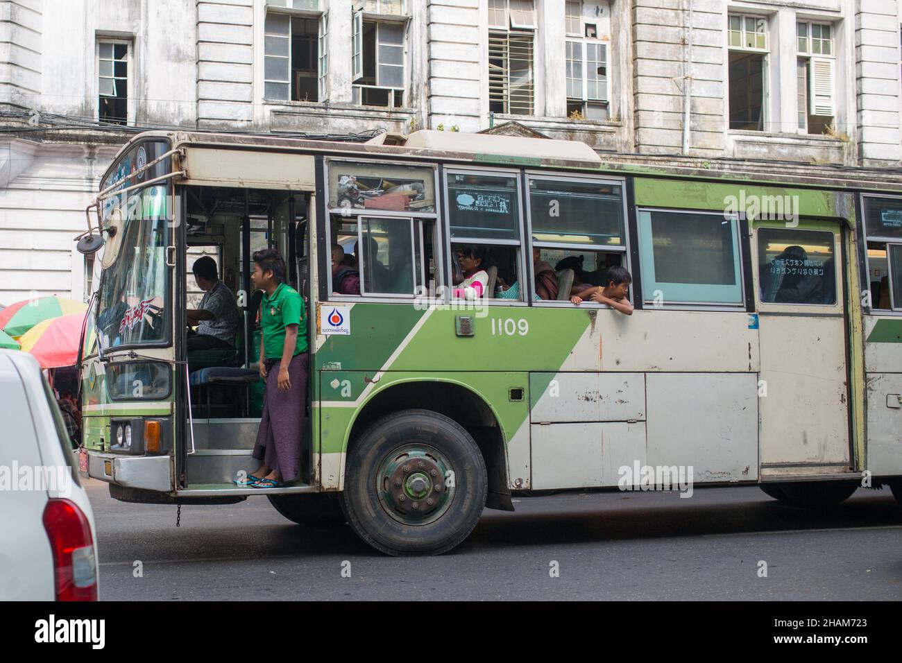 YANGON, MYANMAR - JANUARY 4, 2016: Local buses on the streets of ...