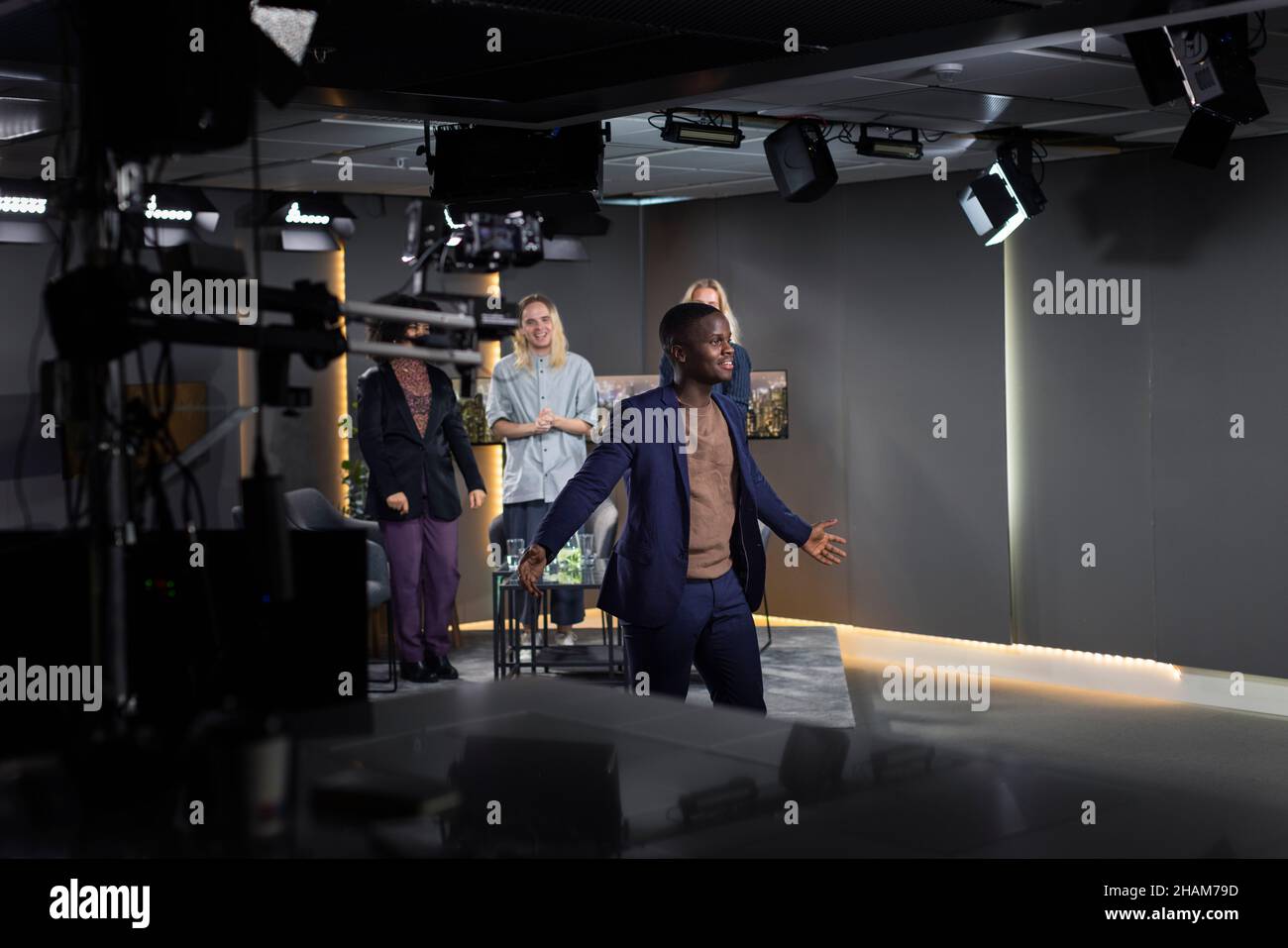TV show host and guests in studio Stock Photo - Alamy