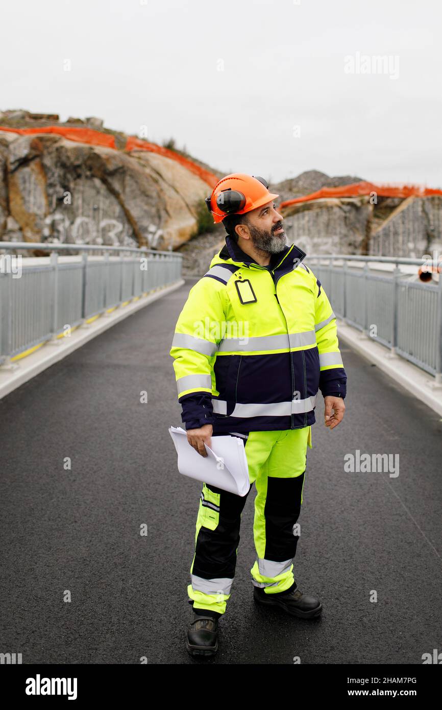 Construction worker reflecting on project hi-res stock photography and ...