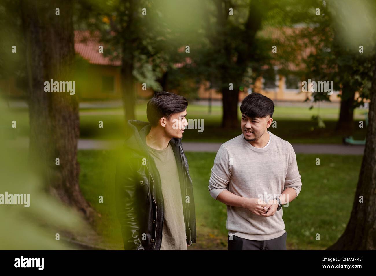 Friends walking together through park hi-res stock photography and ...