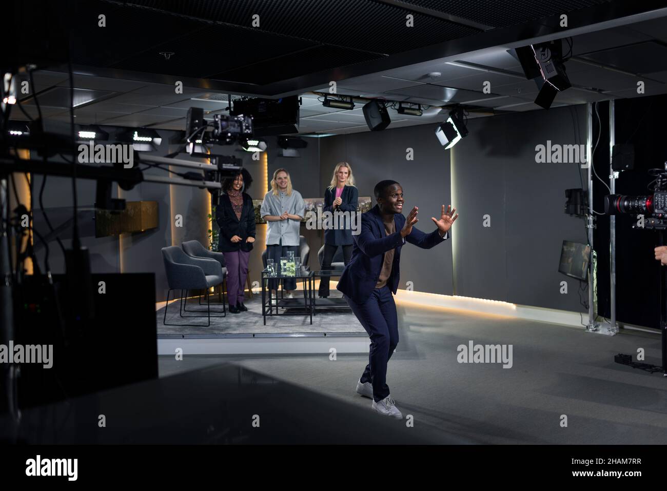 TV show host and guests in studio Stock Photo - Alamy