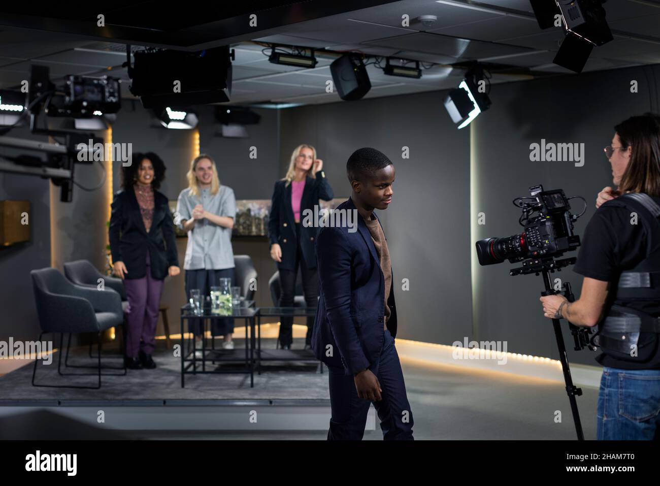 TV show host and guests in studio Stock Photo - Alamy