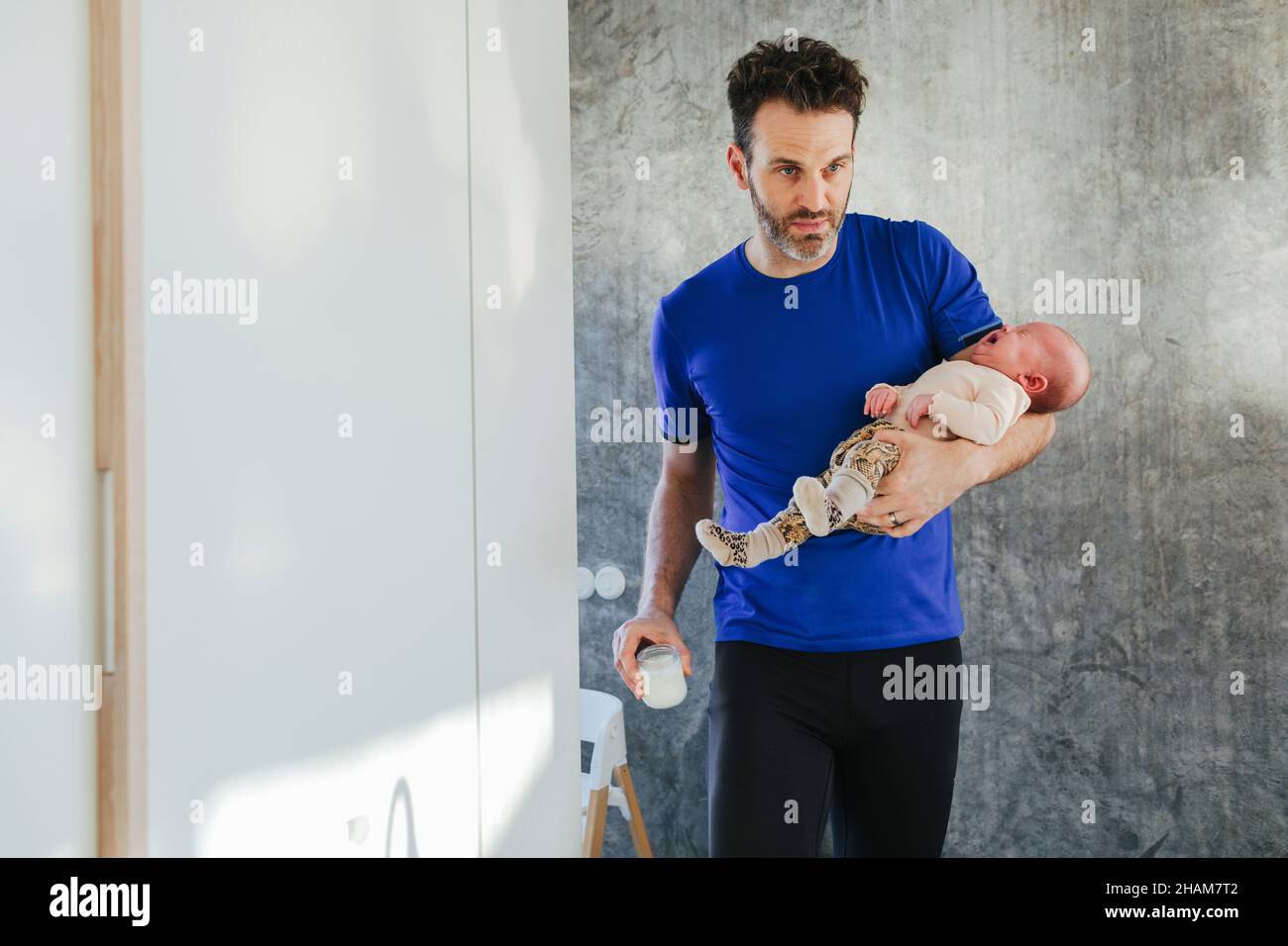 Father carrying baby Stock Photo - Alamy