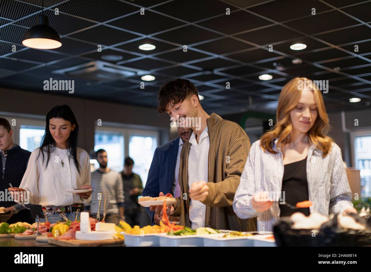 People choosing food in buffet Stock Photo - Alamy