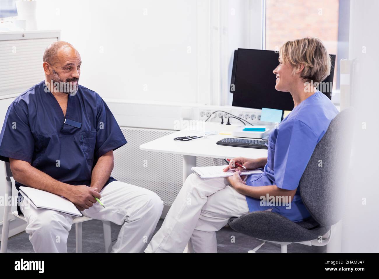Doctors in office Stock Photo - Alamy