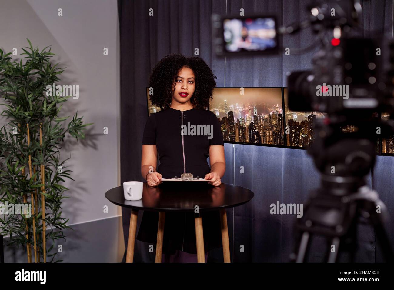 Female news anchor reporting news in studio Stock Photo - Alamy