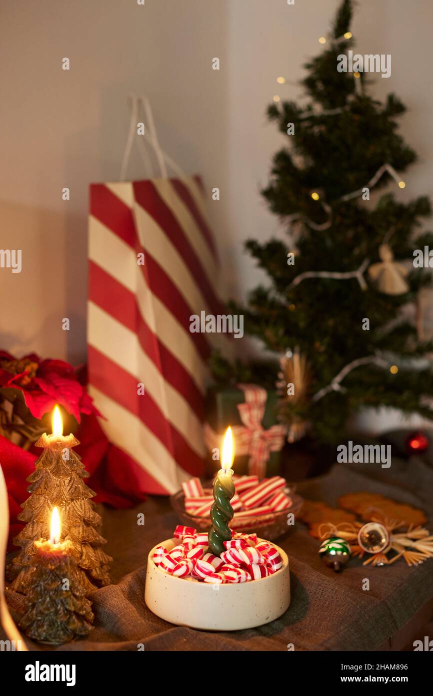 Christmas candy, decorations, and candles Stock Photo - Alamy