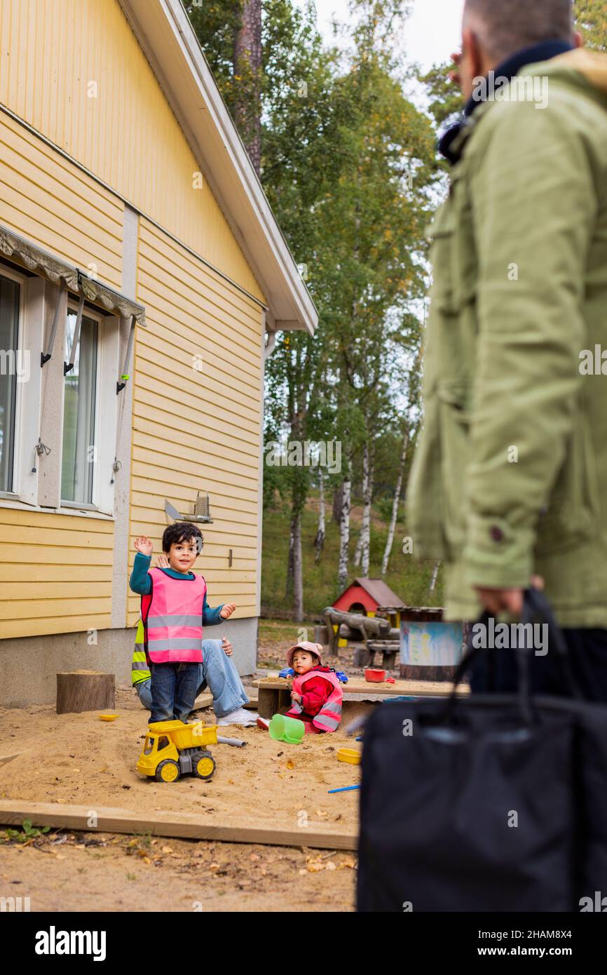 Father collecting child from school Stock Photo - Alamy