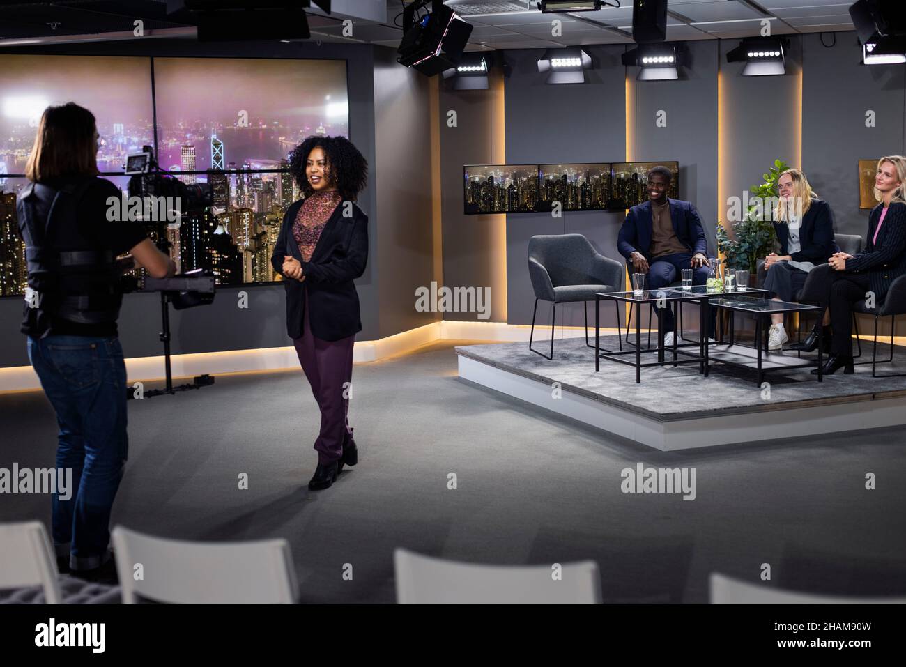 Female TV show host in front of camera Stock Photo - Alamy