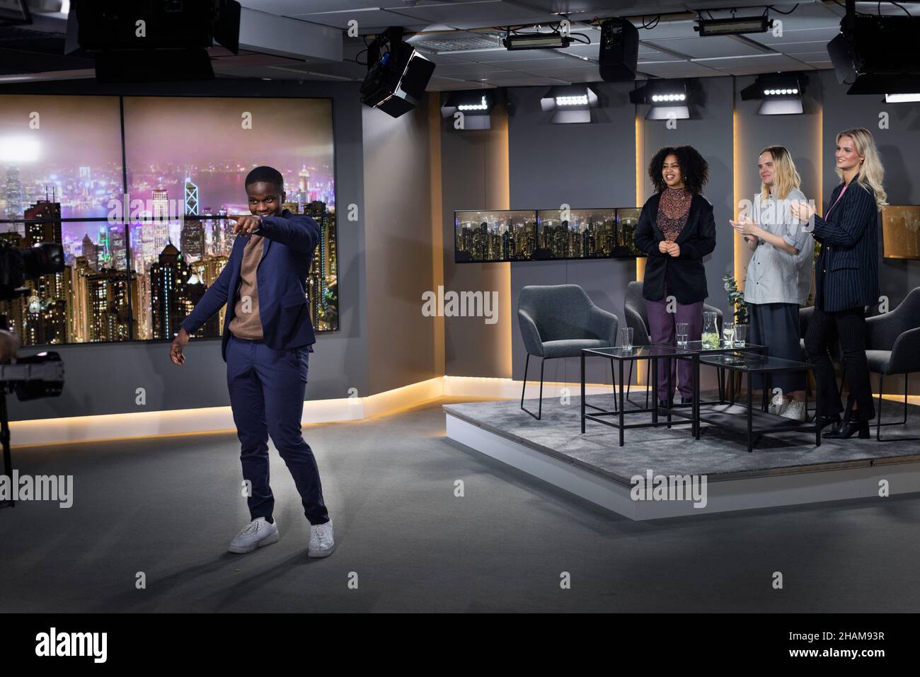 TV show host and guests in studio Stock Photo - Alamy