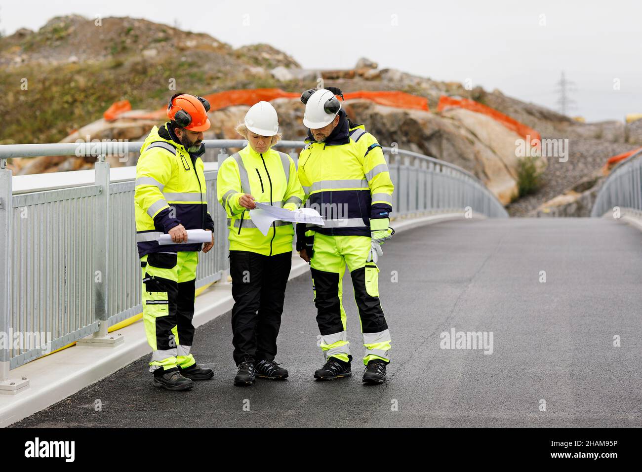 Engineer looking at bridge and plans hi-res stock photography and ...