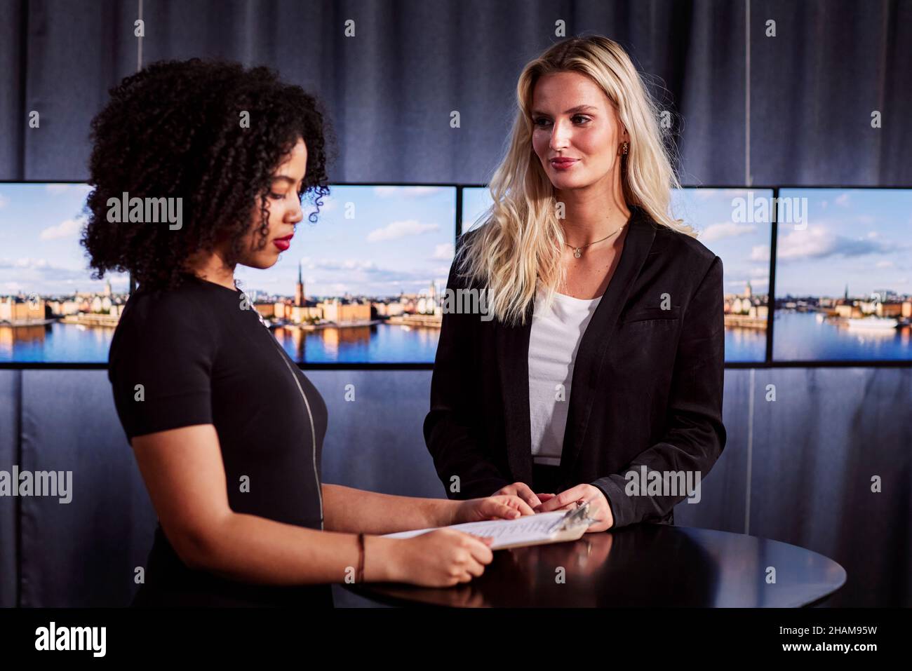Female news anchors reporting news in studio Stock Photo - Alamy