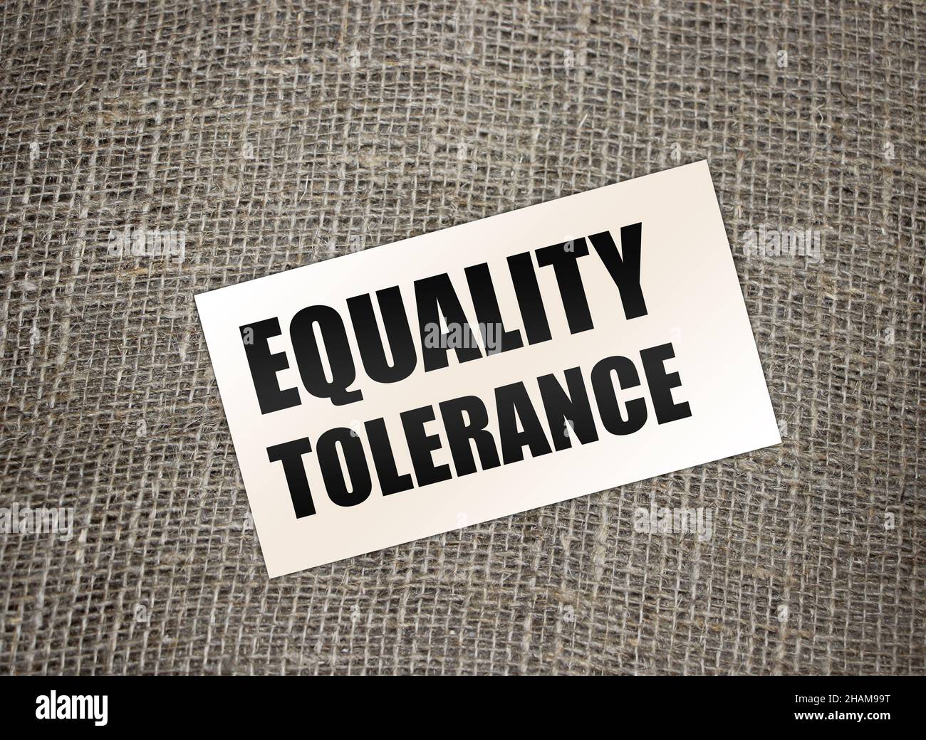 tolerance Equality words on card on burlap canvas. Business concept ...