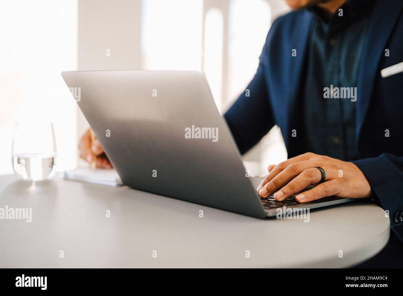 Mans hand working on laptop hi-res stock photography and images - Alamy