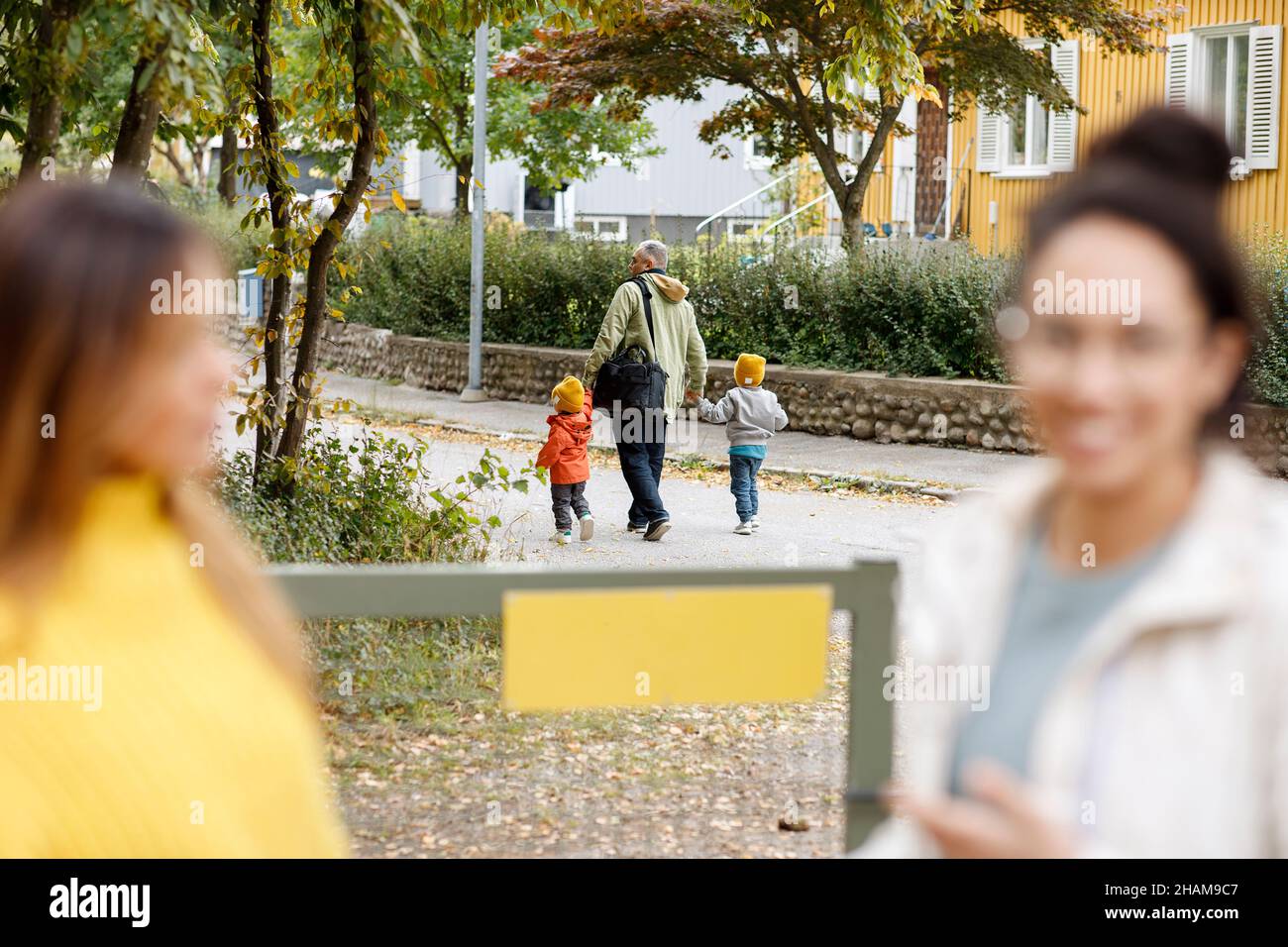 Father walking with children Stock Photo - Alamy