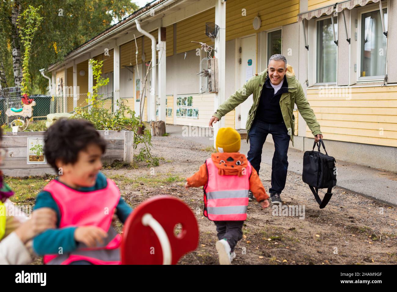 Father collecting child from school Stock Photo - Alamy