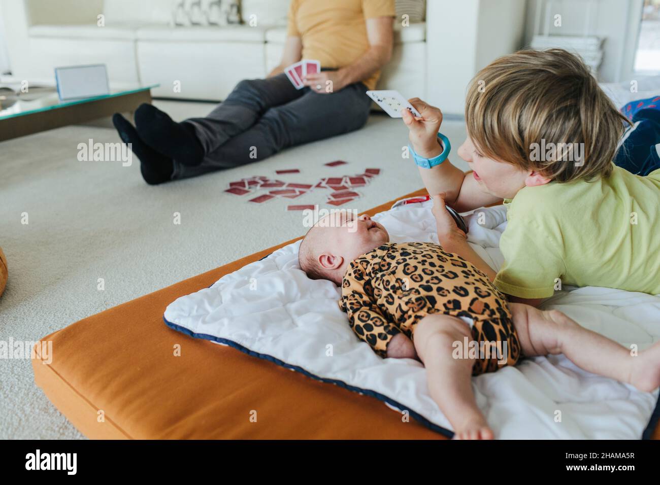 Father playing newborn baby hi-res stock photography and images - Alamy
