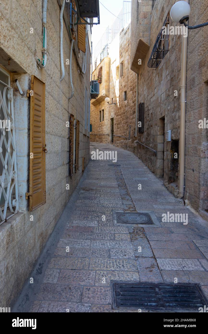 A narrow alley paved with ancient stones on an old and beautiful street ...