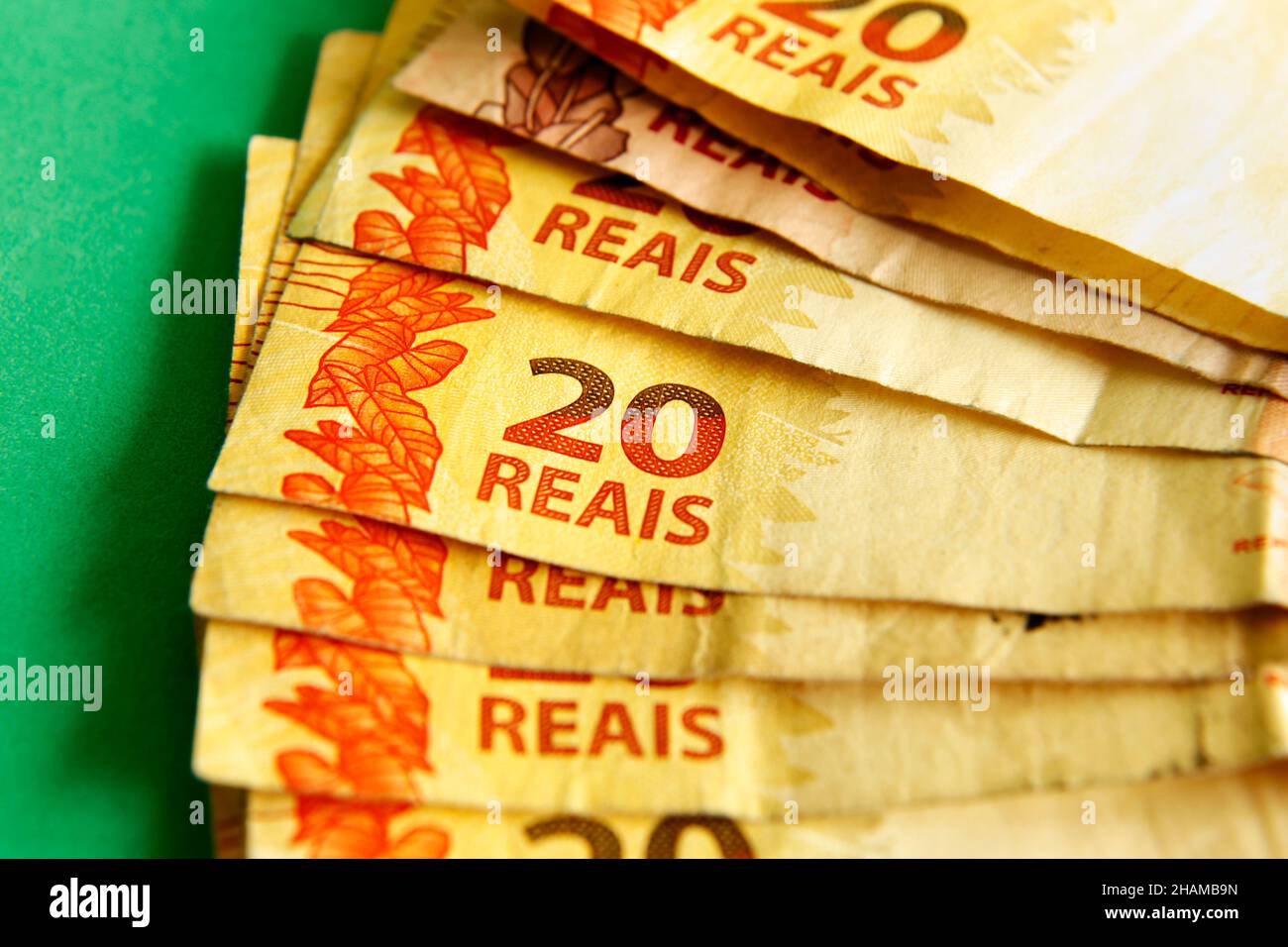 Brazil money stacked on green surface - several real bills Stock Photo ...