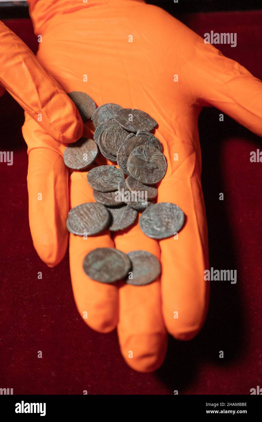 London, UK. 14th December, 2021. A cache of Roman coins found by a ...