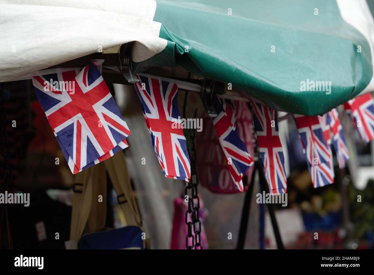 Union Jack bunting shows flags all in a row at a market stall Stock ...