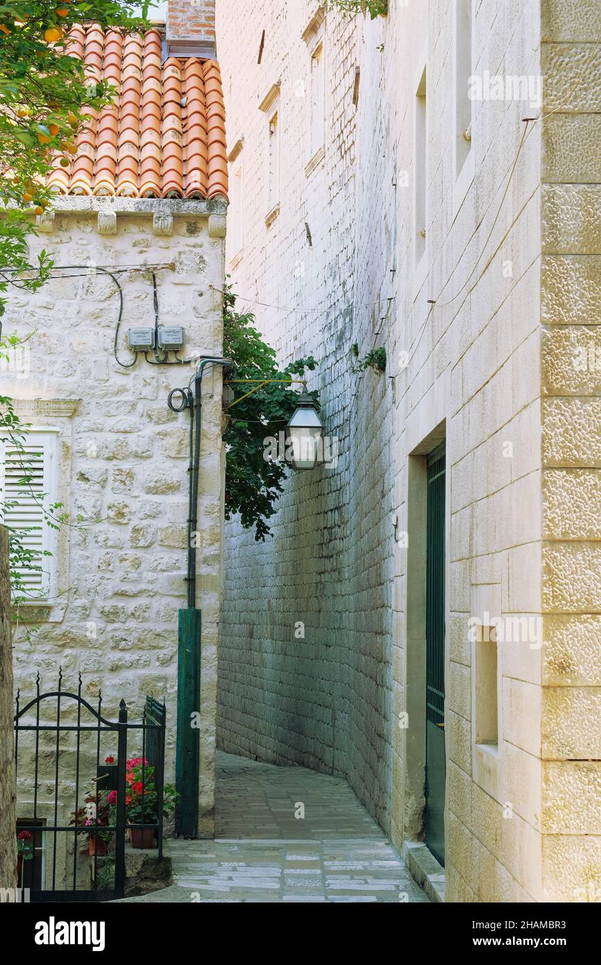 Between walls of houses. Passage between walls to the old town, the ...