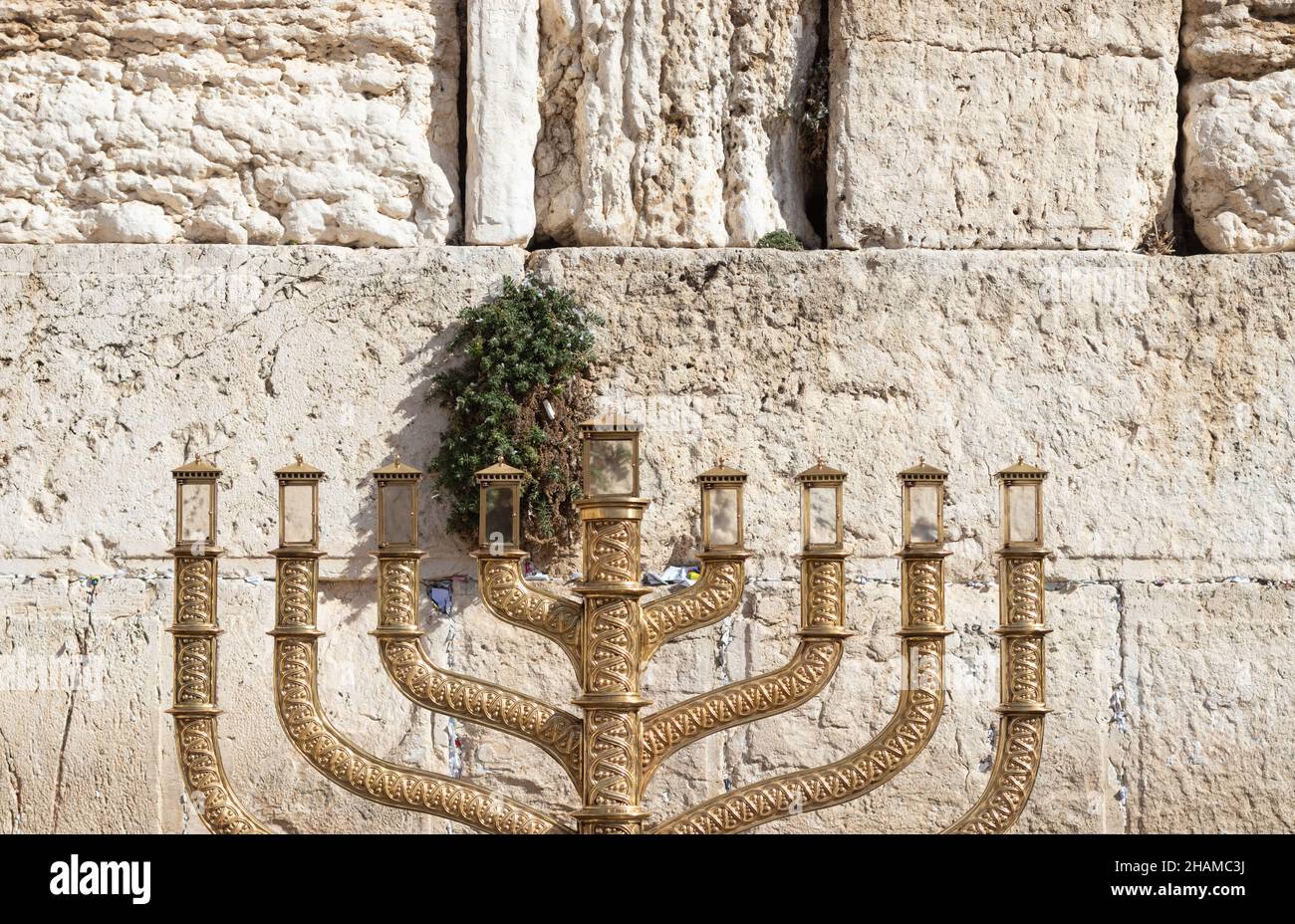 The huge traditional and state-owned menorah in the Western Wall plaza ...