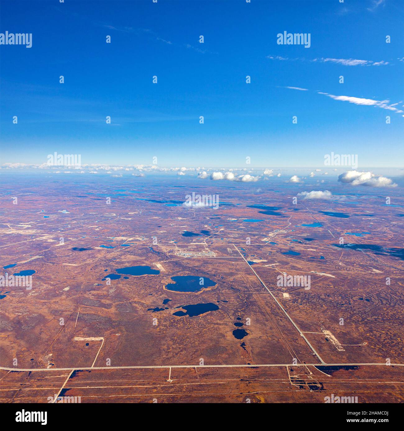 Aerial view of the tundra in autumn. Oilfield in marsh terrain under ...