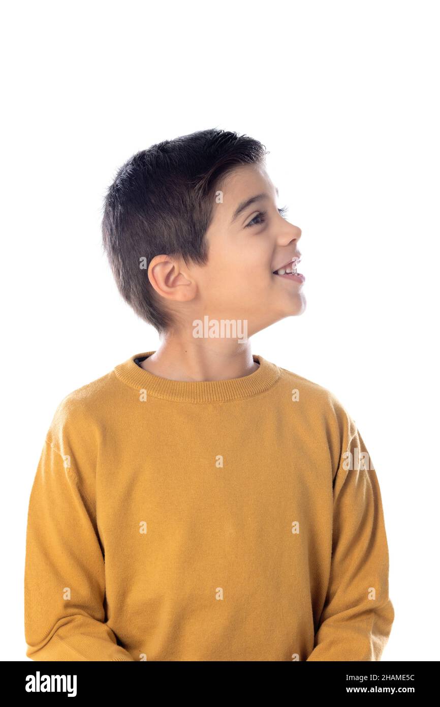 Pensive cute Spanish child with yellow t-shirt isolated on a white ...